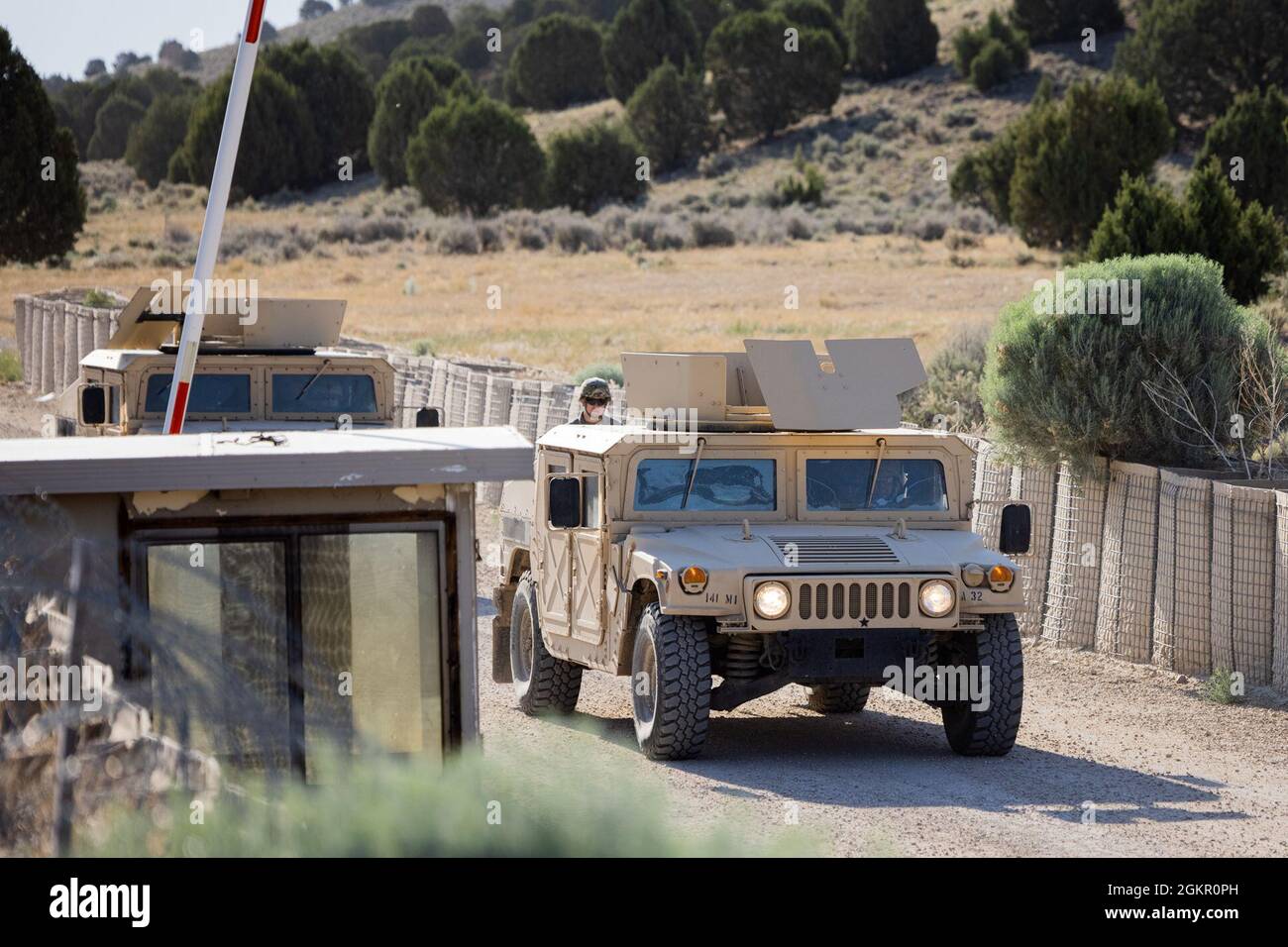 A convoy rolls into a tactical training environment at Camp Williams ...