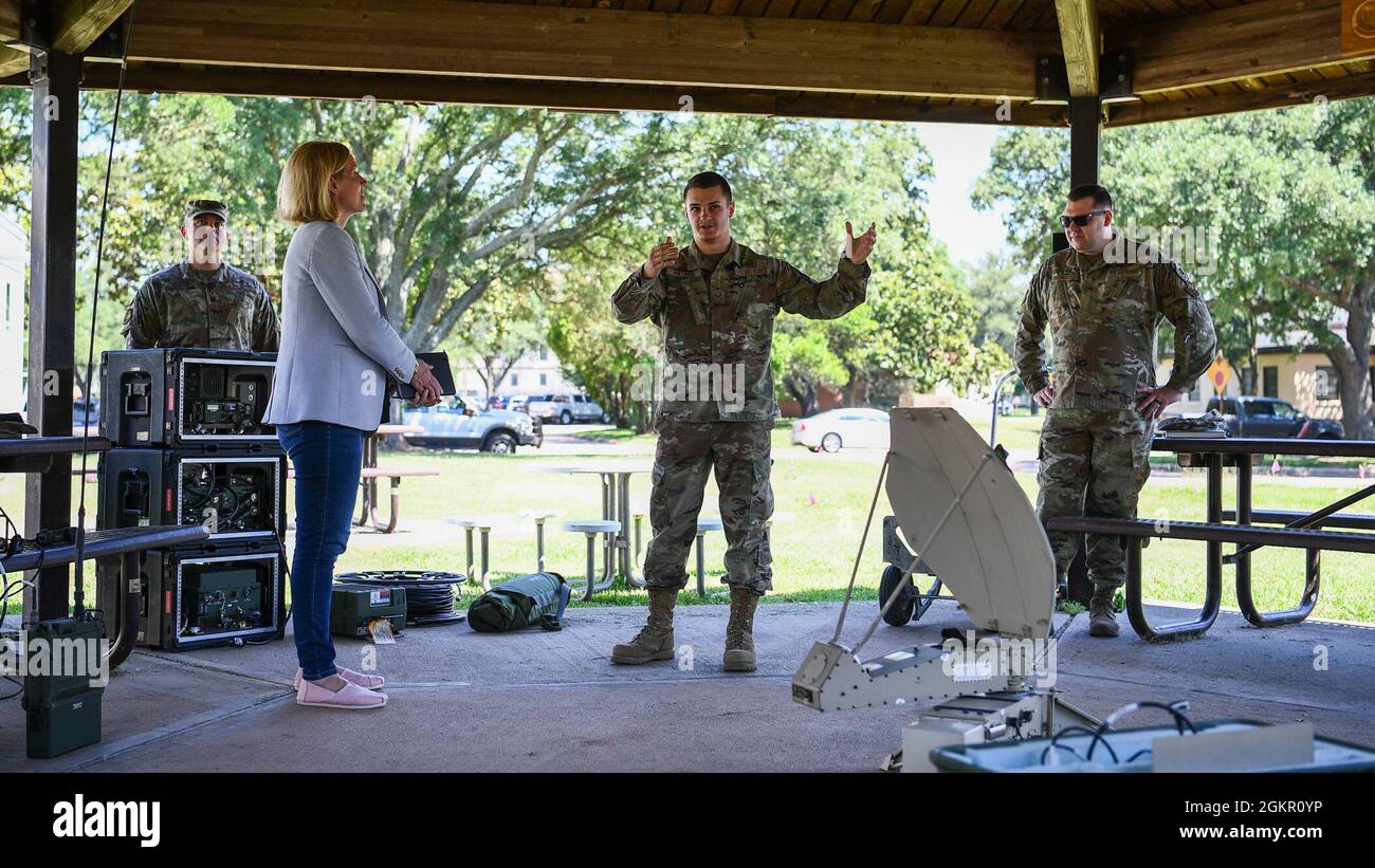 Senior Airman Michael Watkins, center, 2nd Communications Squadron ...