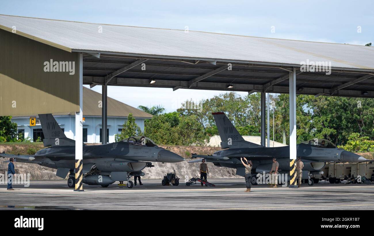 U.S. Air Force Staff Sgt. Kathrine Ancheta marshals U.S. Air Force Capt ...