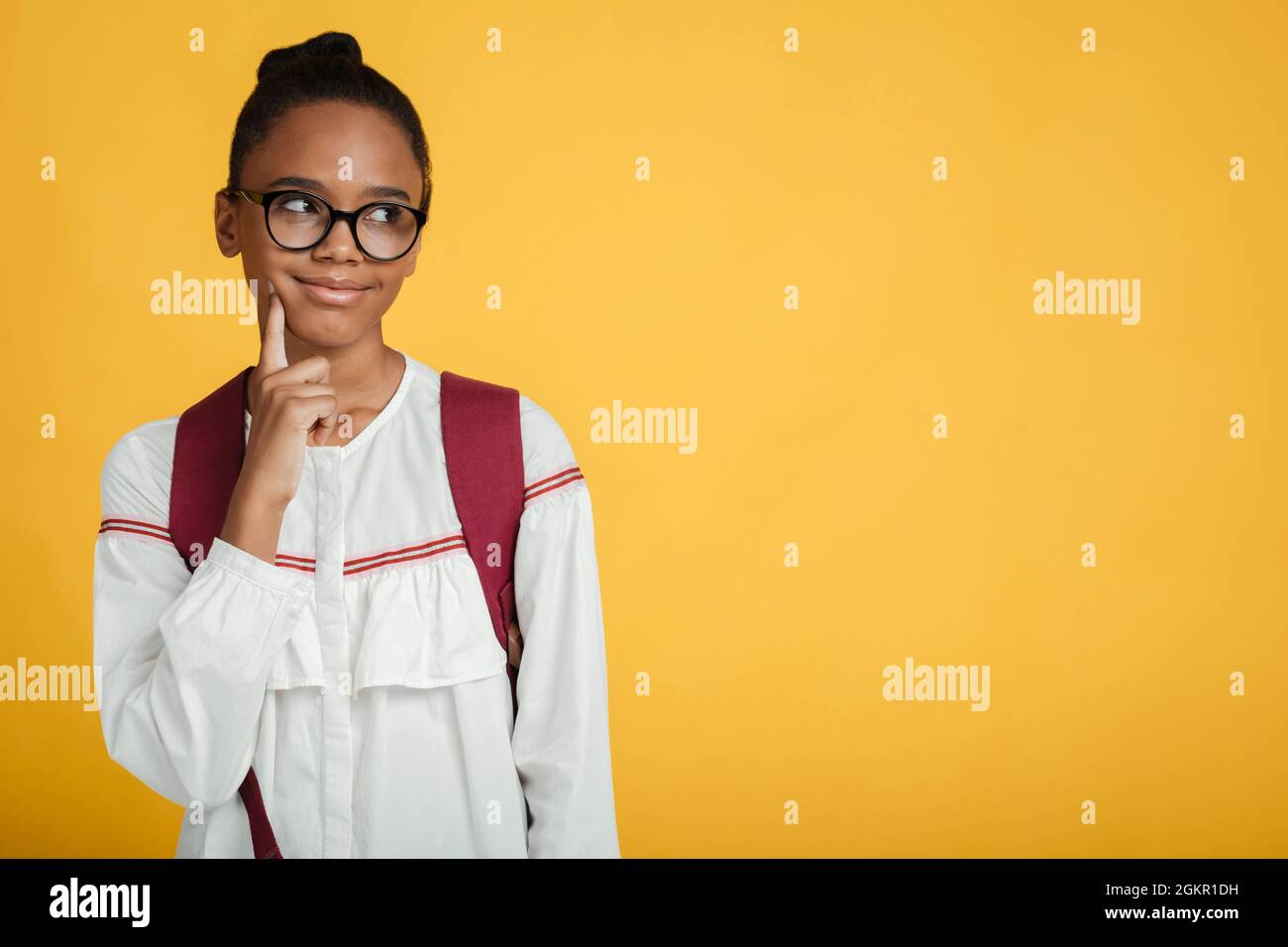 Pensive smart teen afro american female pupil in glasses with backpack ...