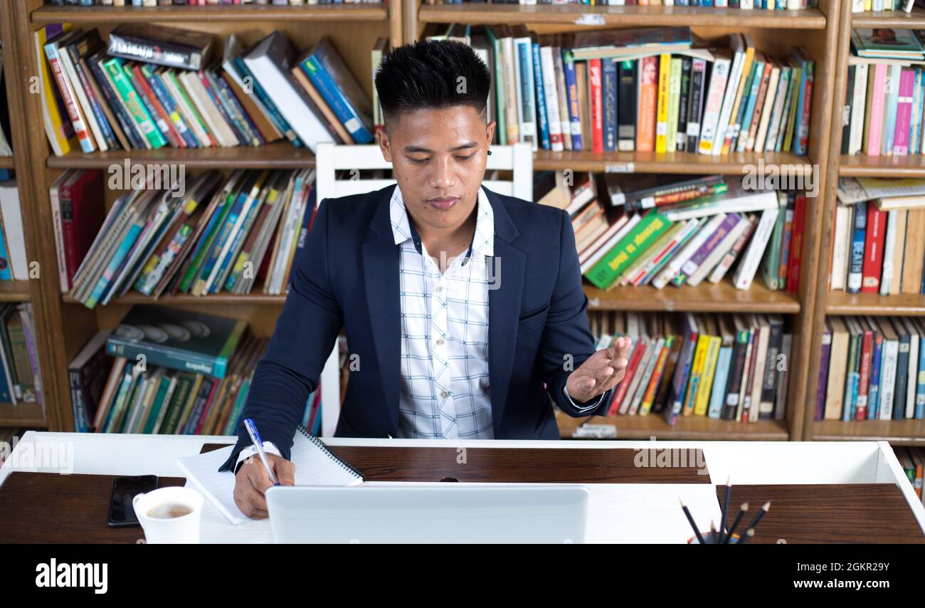 Asian student man studying in hi-res stock photography and images - Alamy