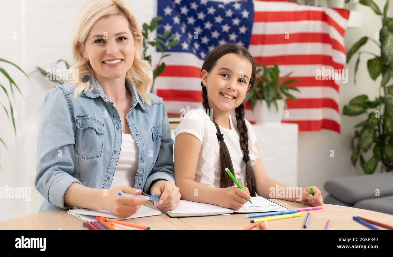 Young girl learning english with teacher Stock Photo - Alamy