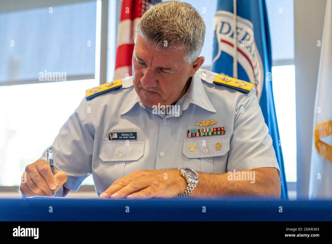 Adm. Karl L. Schultz, the commandant of the Coast Guard, and The ...