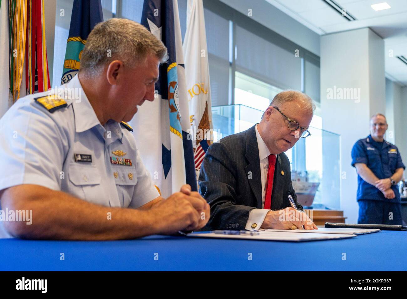 Adm. Karl L. Schultz, the commandant of the Coast Guard, and The ...