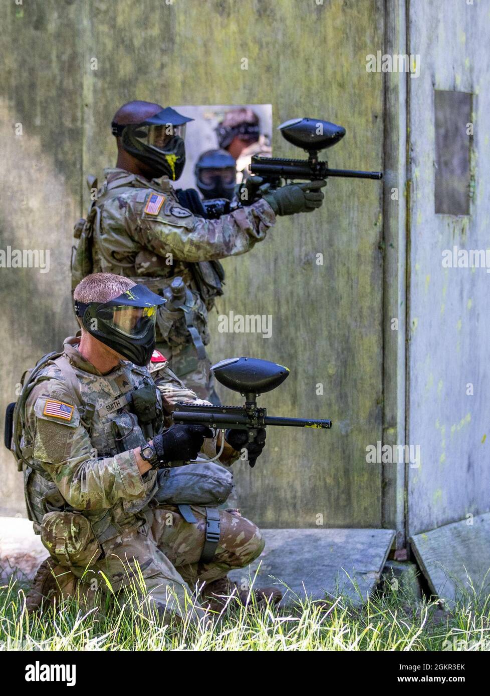 Spc. Zachery Smith, front, and Master Sgt. Christopher Windless, from ...