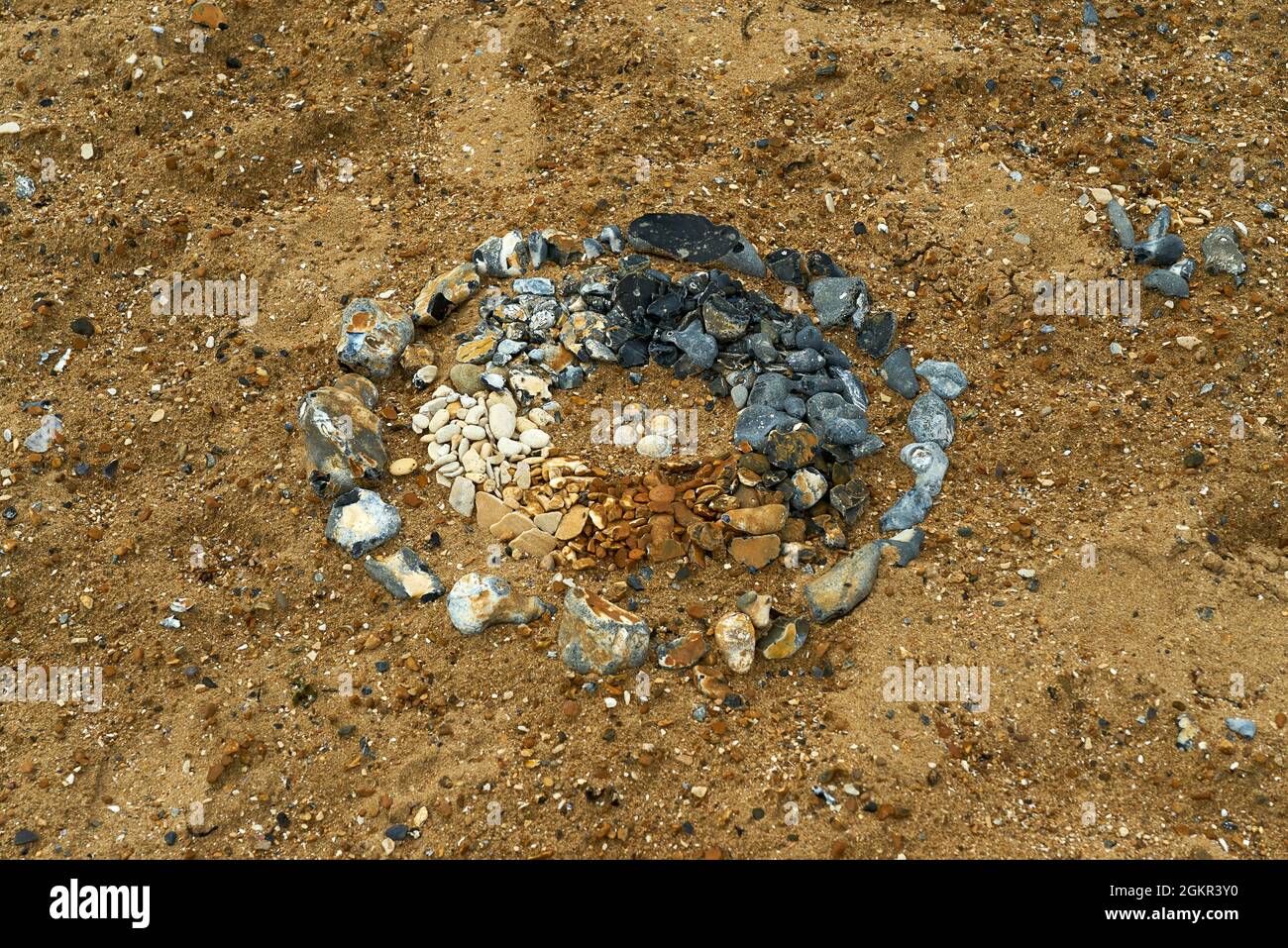 Man-made rock patterns on the beach Stock Photo - Alamy