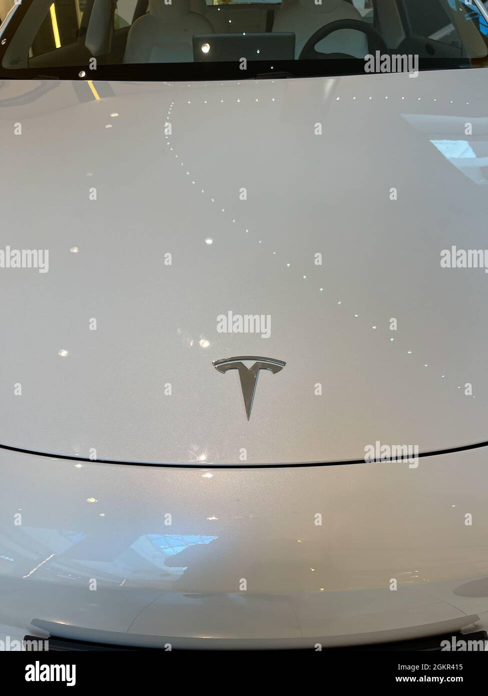 Metallic white Tesla Model 3 at Athens Golden Hall. Produced by ...