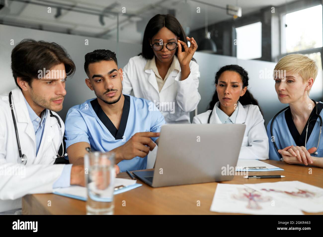 Doctors conference table nurses serious hi-res stock photography and ...