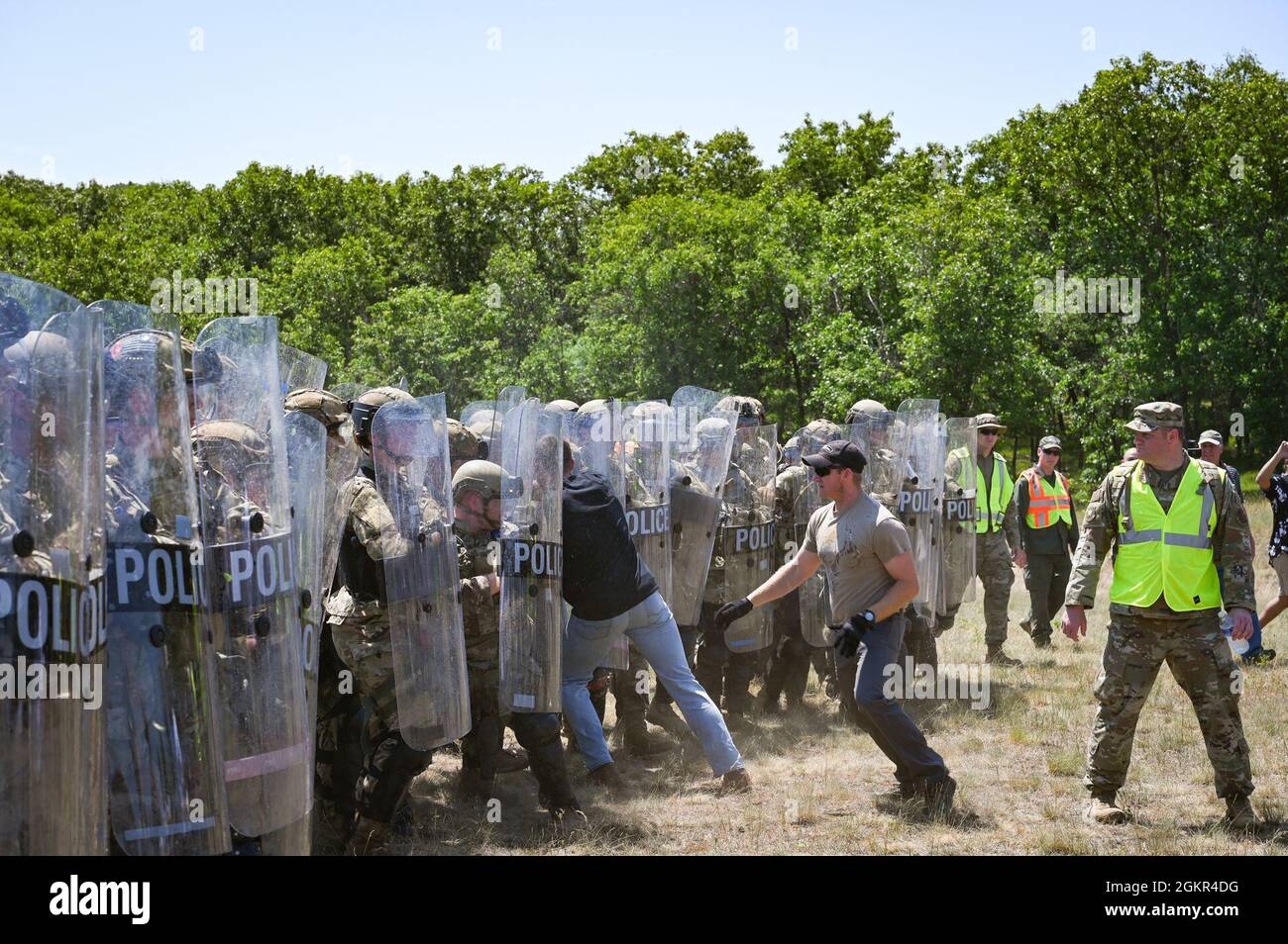 U.S. Air Force security forces members wearing civilian clothing act as ...