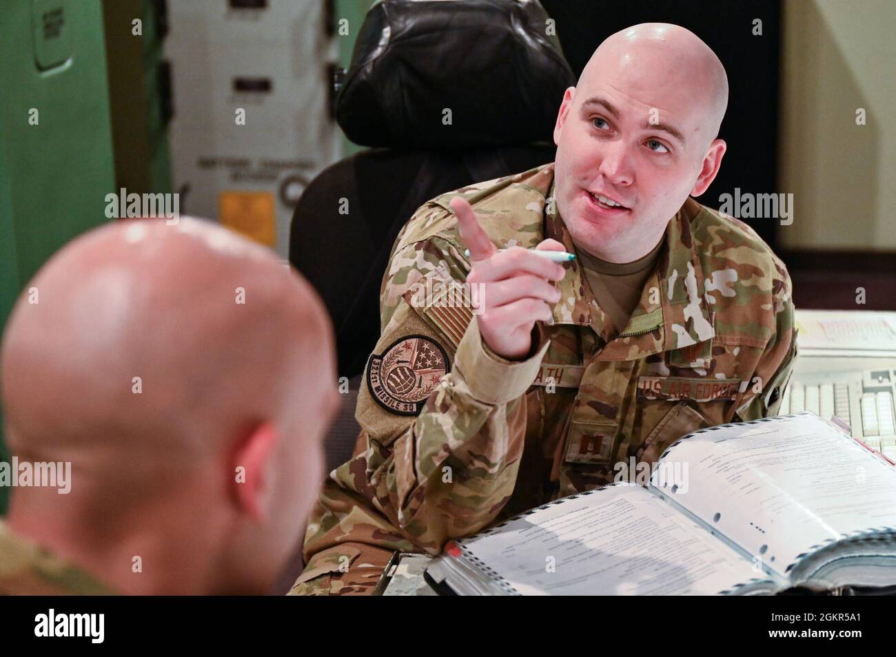Capt. Christian Heath, 321st Missile Squadron, discusses an emergency ...