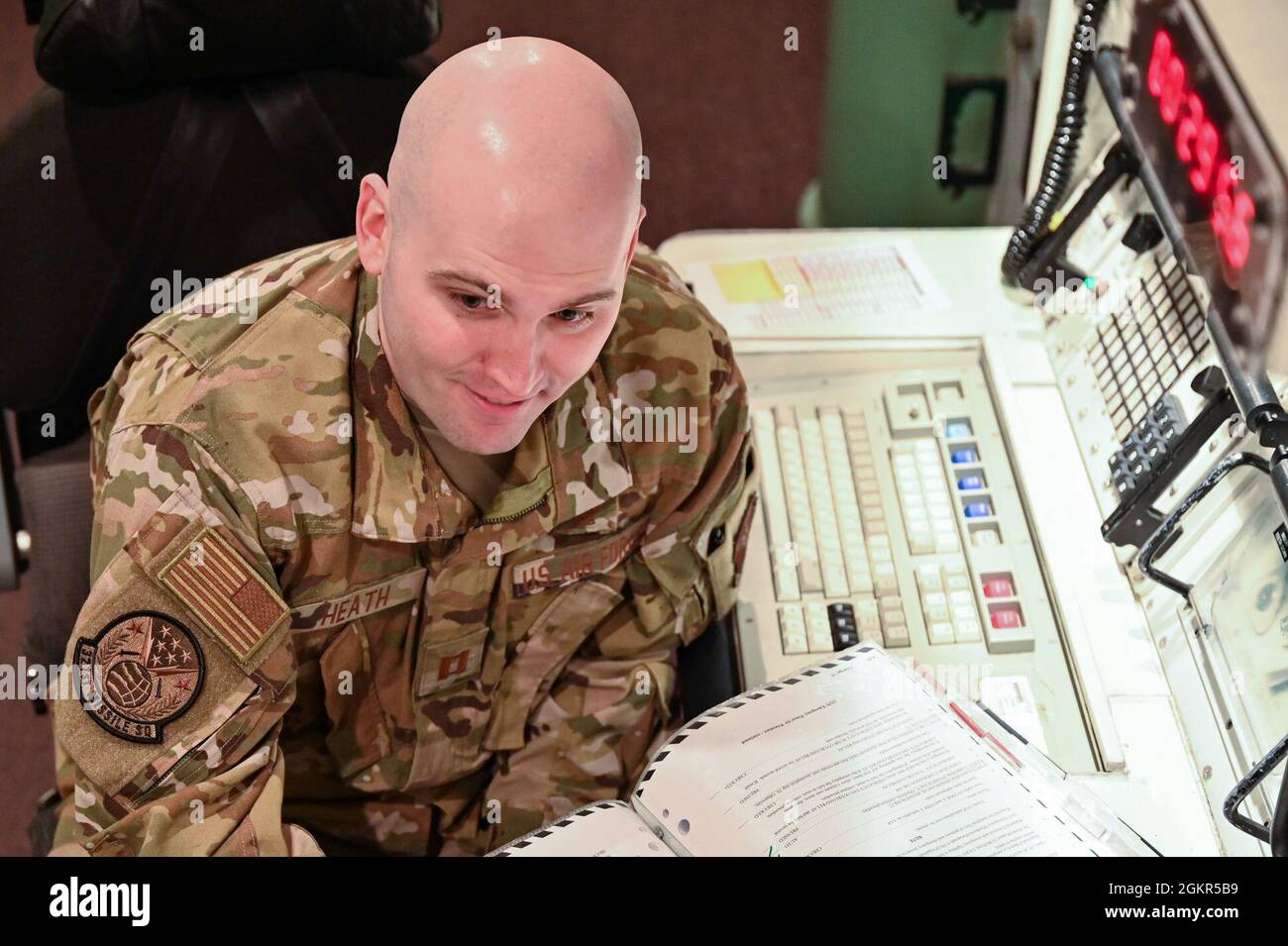 Capt. Christian Heath, 321st Missile Squadron, discusses an emergency ...