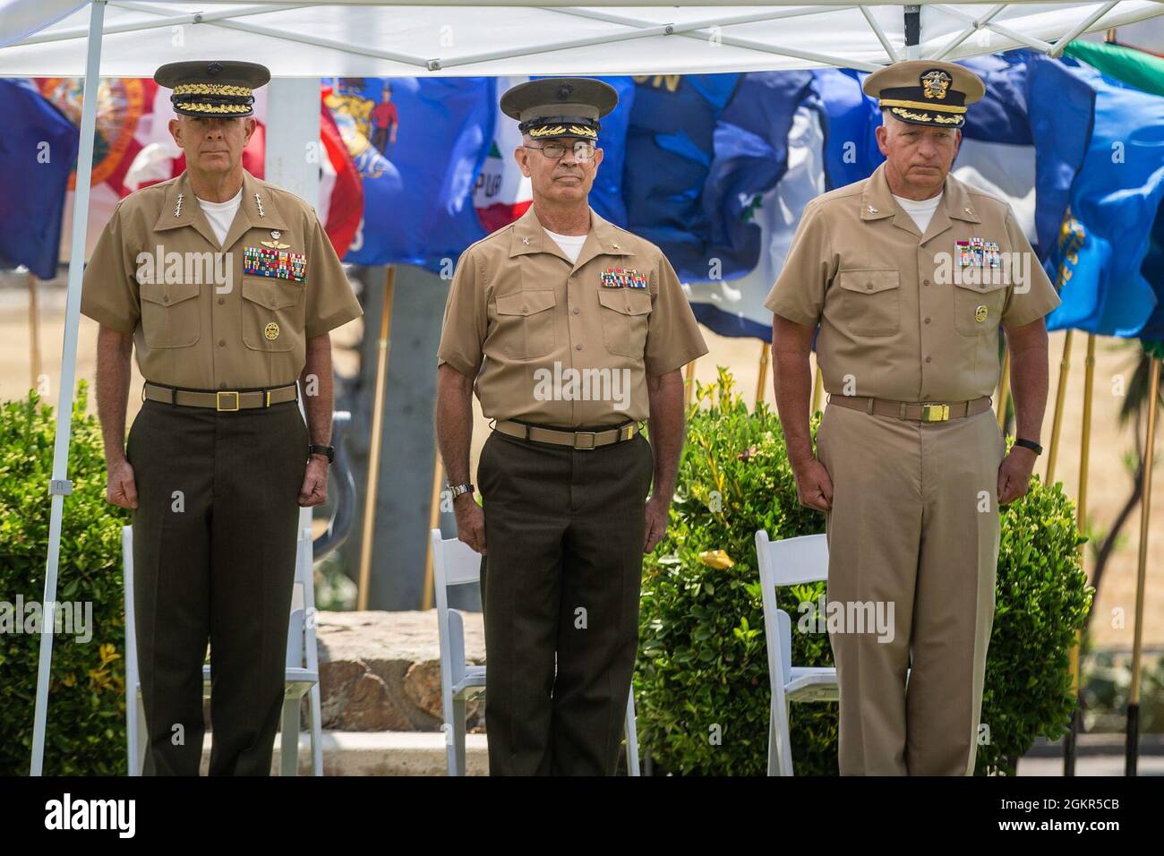 U.S. Navy Capt. Kevin Sweeney, center, the command chaplain for Marine ...