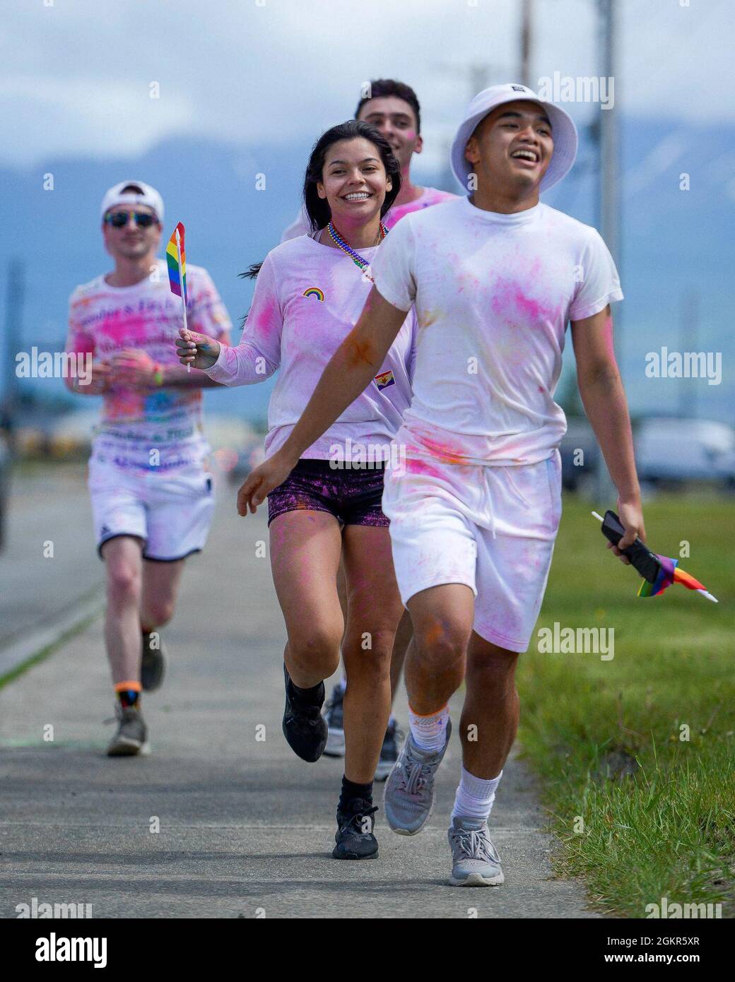 Participants run during the Pride 5K Color Run at Joint Base Elmendorf ...