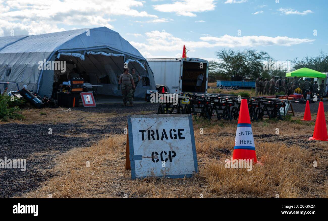 A triage casualty collection point is set up before the second day of a ...