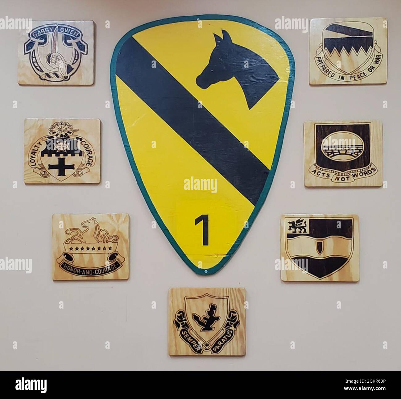 Wooden plaques and a 1st Cavalry Division Sign hang on the wall in ...