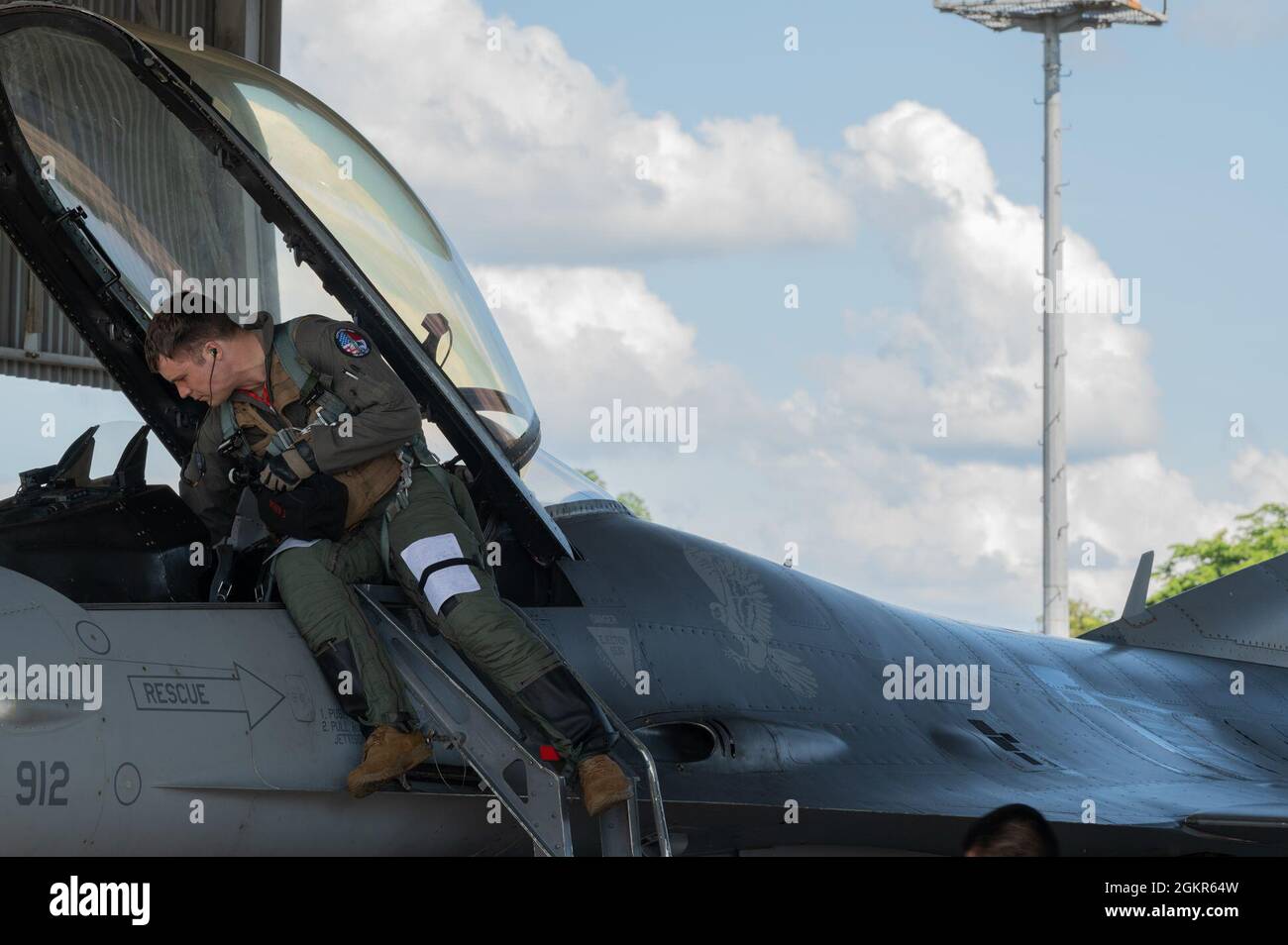 U.S. Air Force Capt. Jay "Bull" Belanus departs an F-16 Fighting Falcon ...