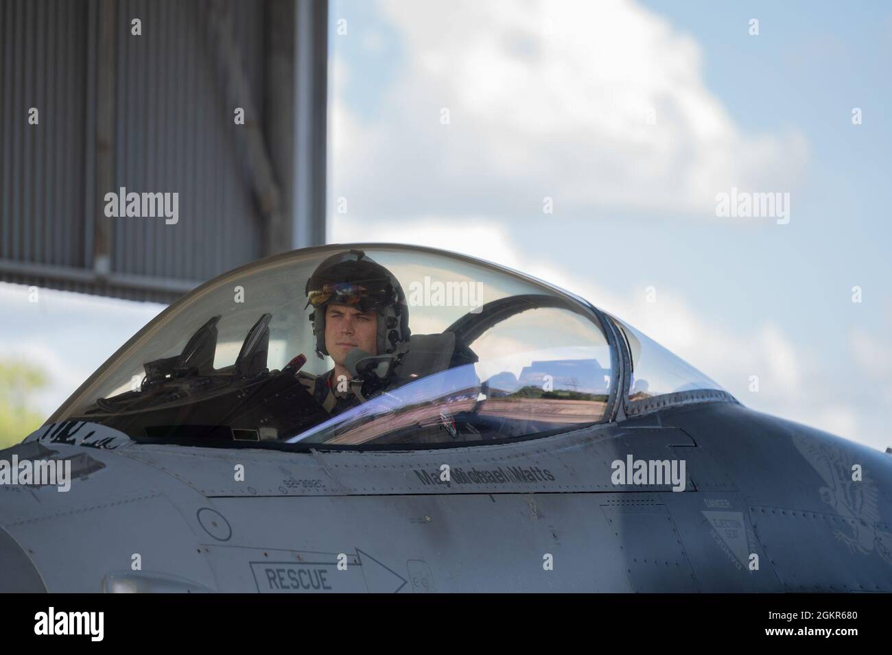 U.S. Air Force Capt. Jay "Bull" Belanus sits in an F-16 Fighting Falcon ...