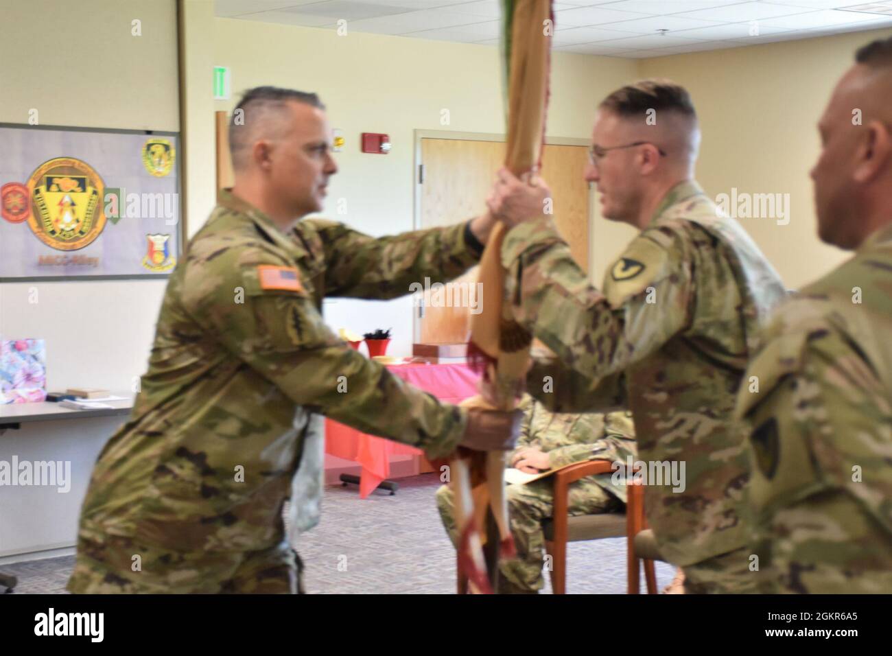 Lt. Col. Robert Bartruff passes the colors of the 923rd Contracting ...