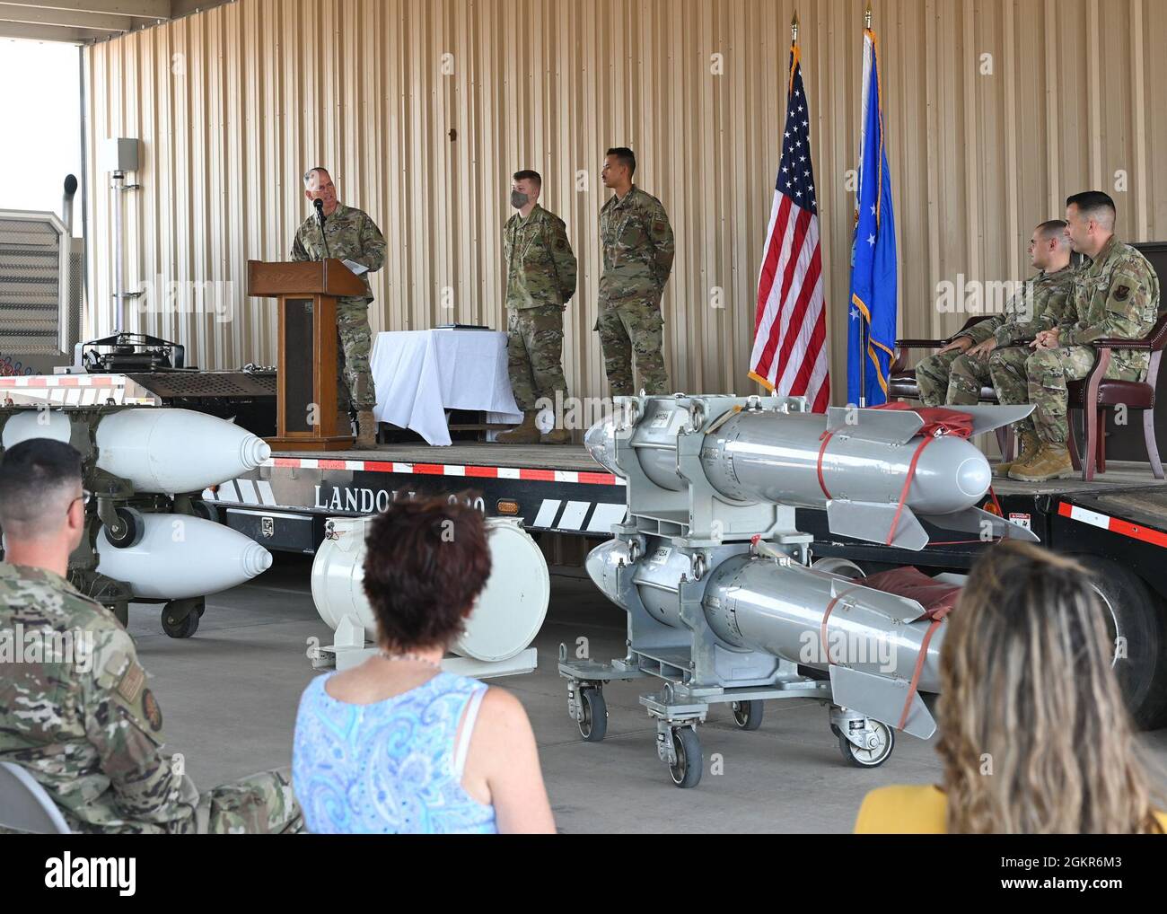 Members of Team Kirtland listen to a speech by Col. Christopher Graves ...