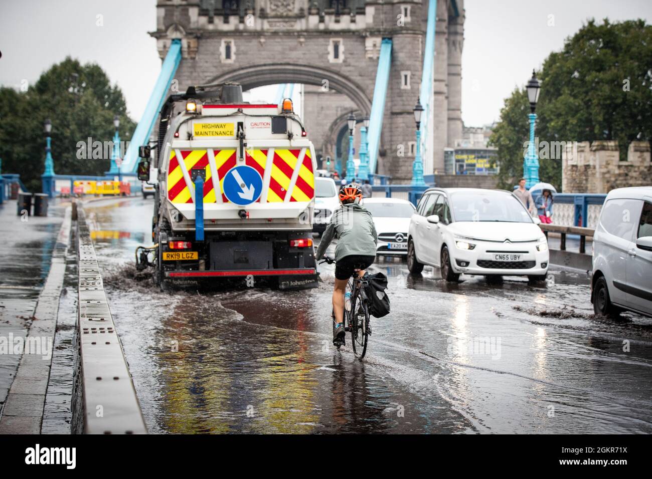 A maintenance vehicle uses a vacuum pump to suck up flood water on ...