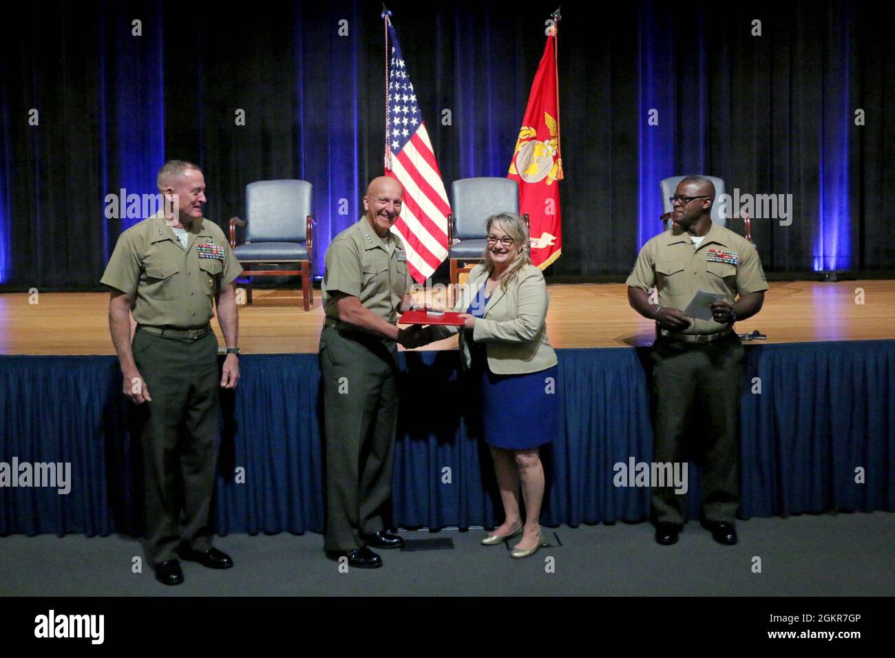 Lieutenant General (LtGen) Charles Chiarotti presents Dawn Carol with a ...