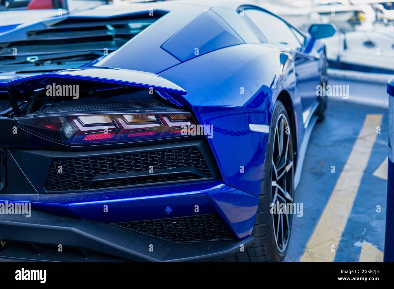 Rear view of a blue modern sport car on city beach background Stock ...