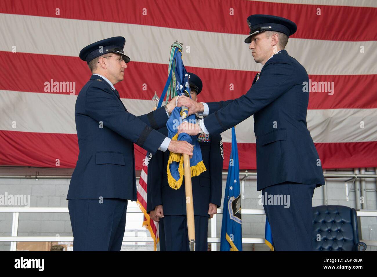 U.S. Air Force Col. Caleb Nimmo, right, accepts command of the 492d ...