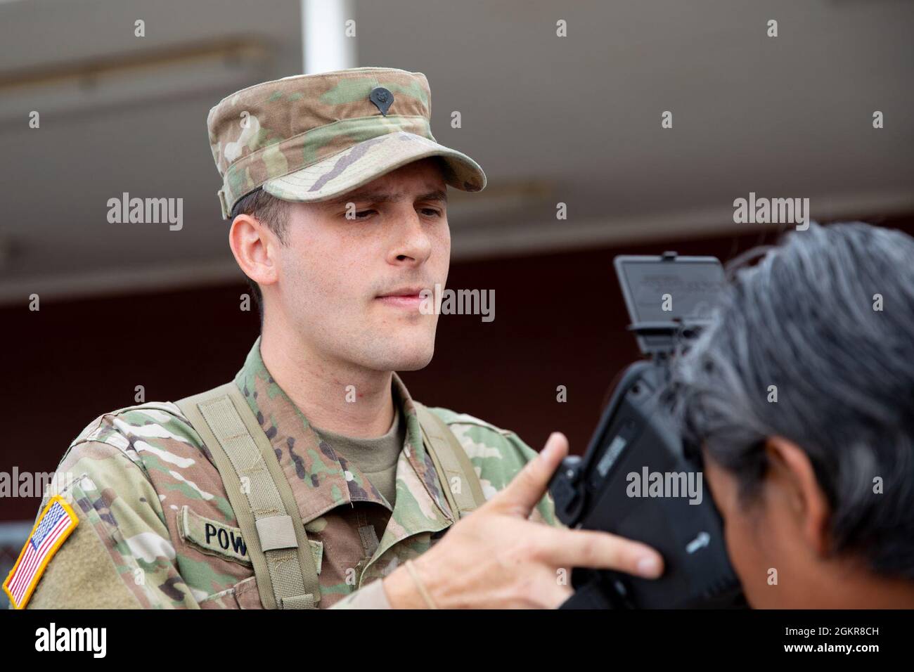 Spc. Kade Powell uses a Seek device to scan role-player’s eyes during a ...