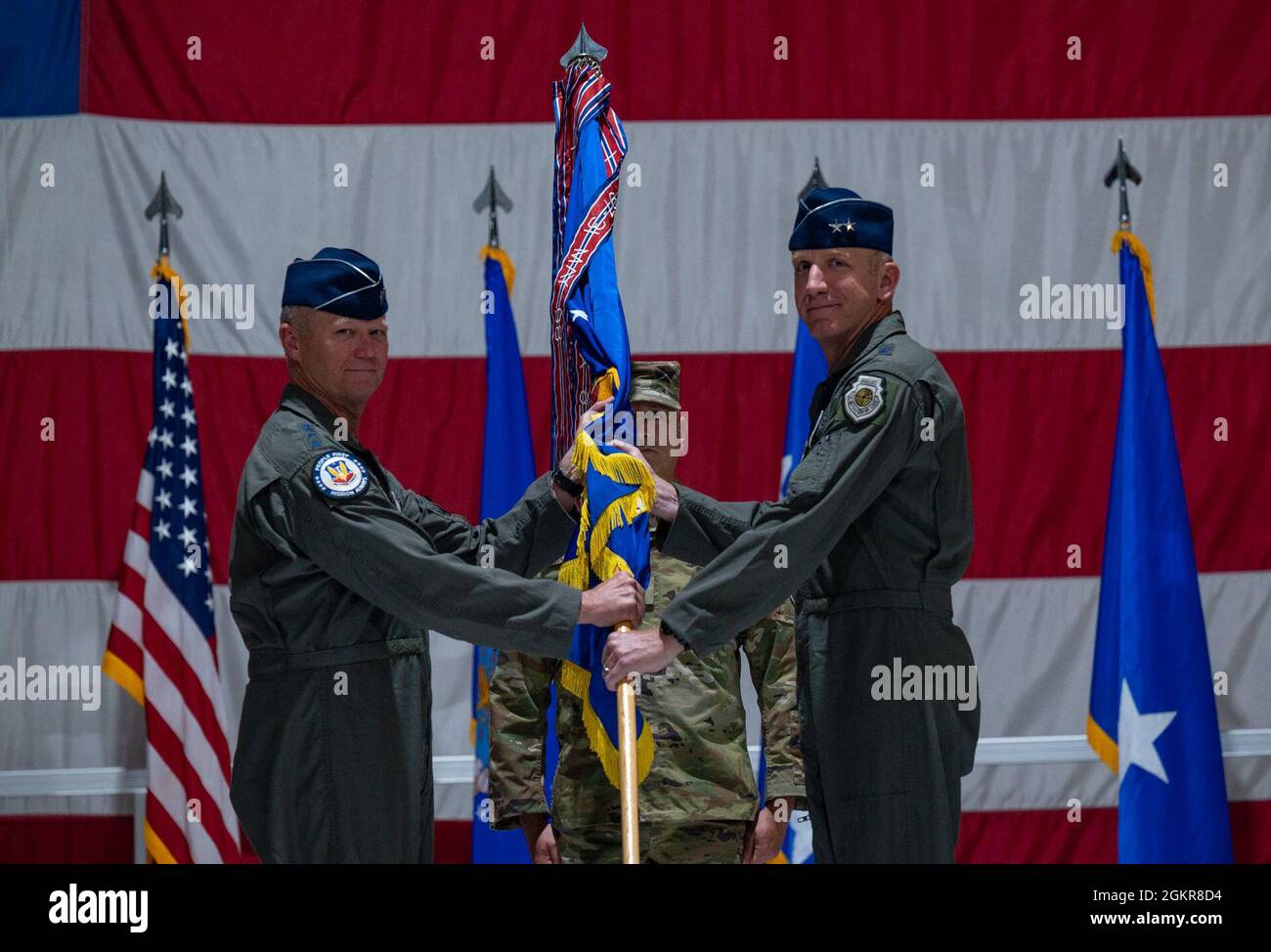 Gen. Mark Kelly, commander of Air Combat Command, passes the guidon to ...