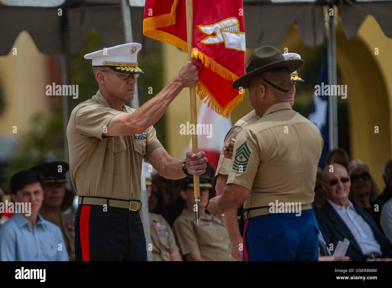 SgtMaj. Abel T. Leal hands over the colors to BGen. Ryan P. Heritage ...