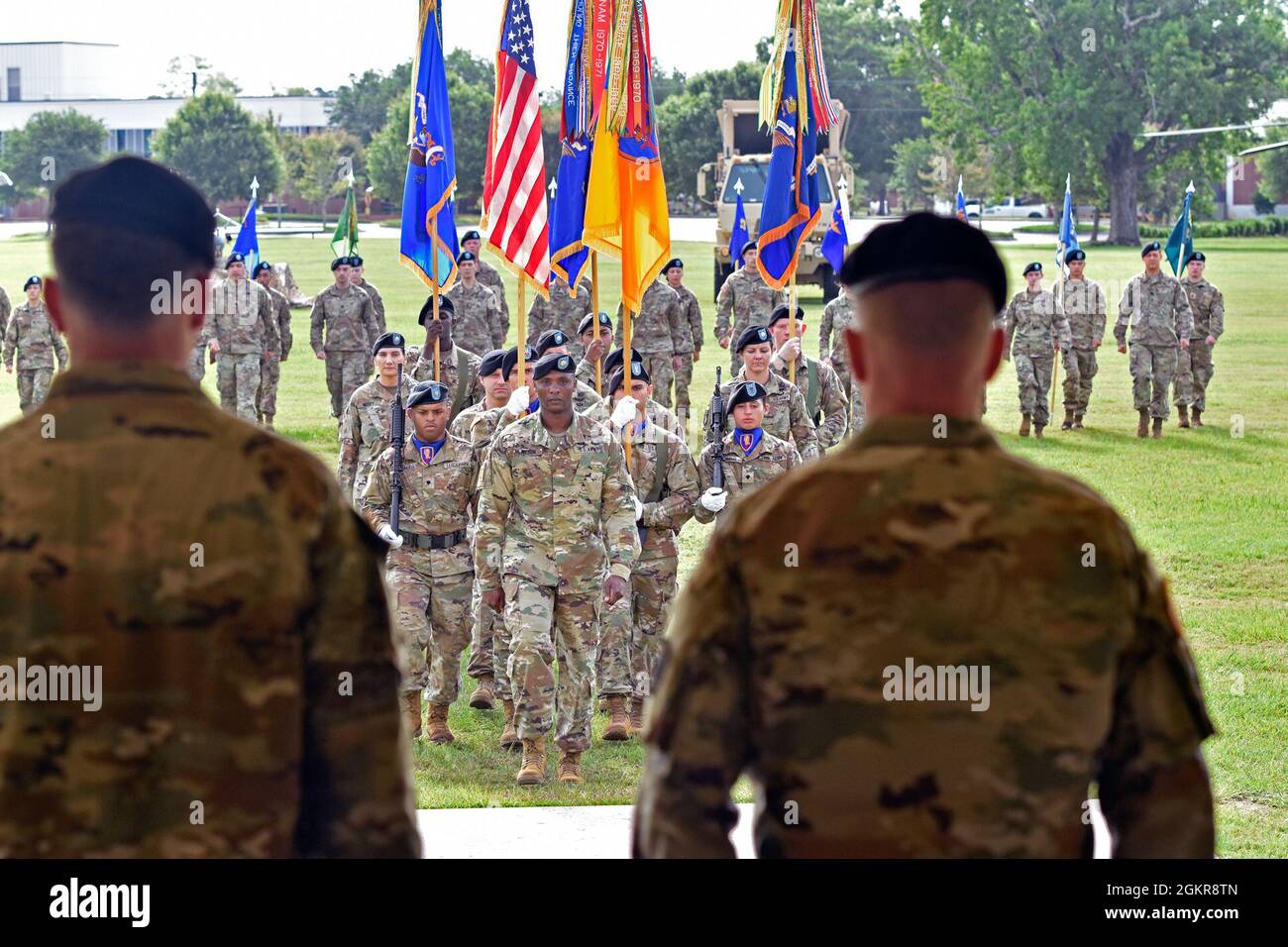 The 1st Aviation Brigade colors march toward the official party during ...