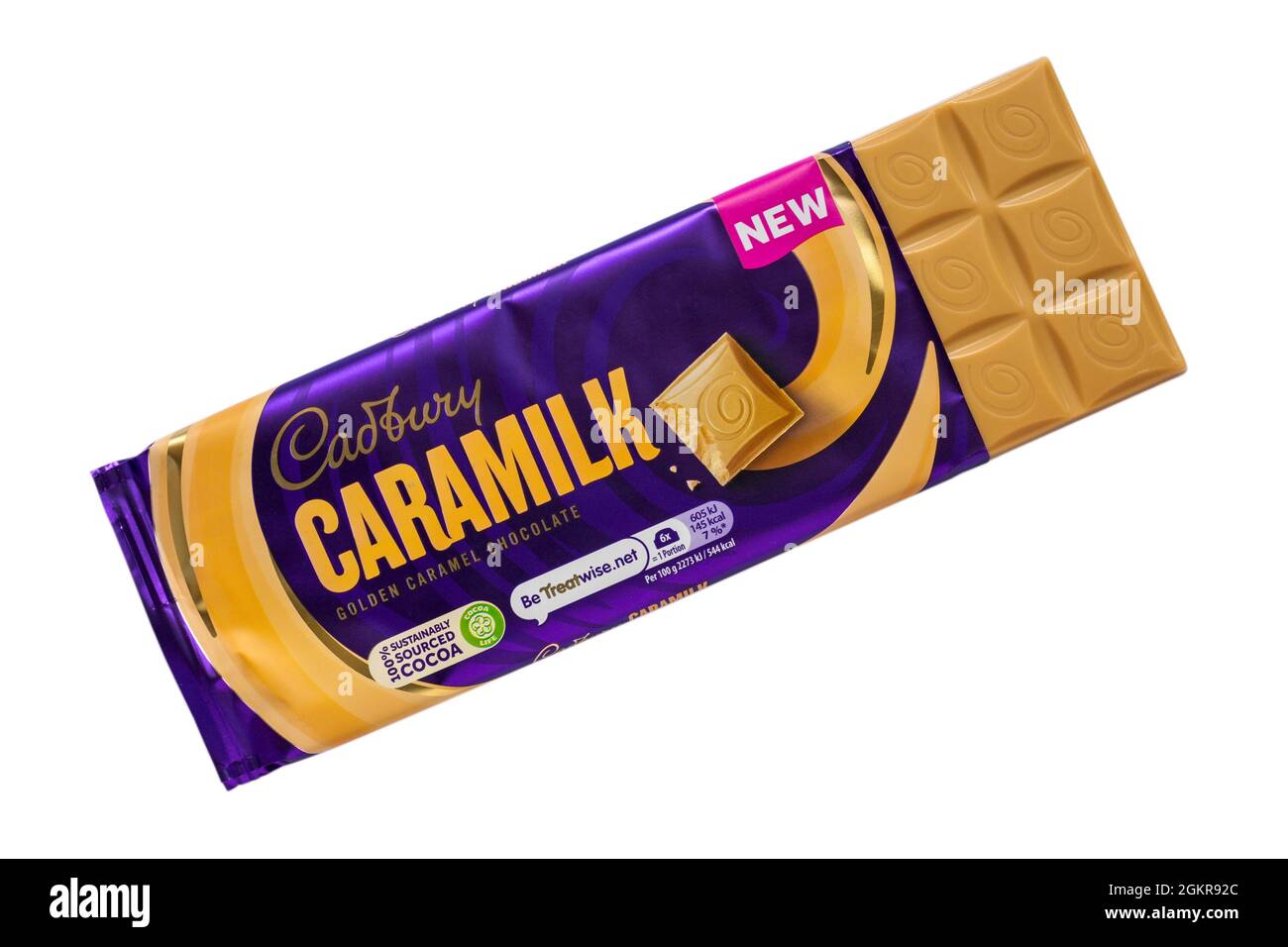 Bar of Cadbury Caramilk chocolate bar opened to show contents isolated ...