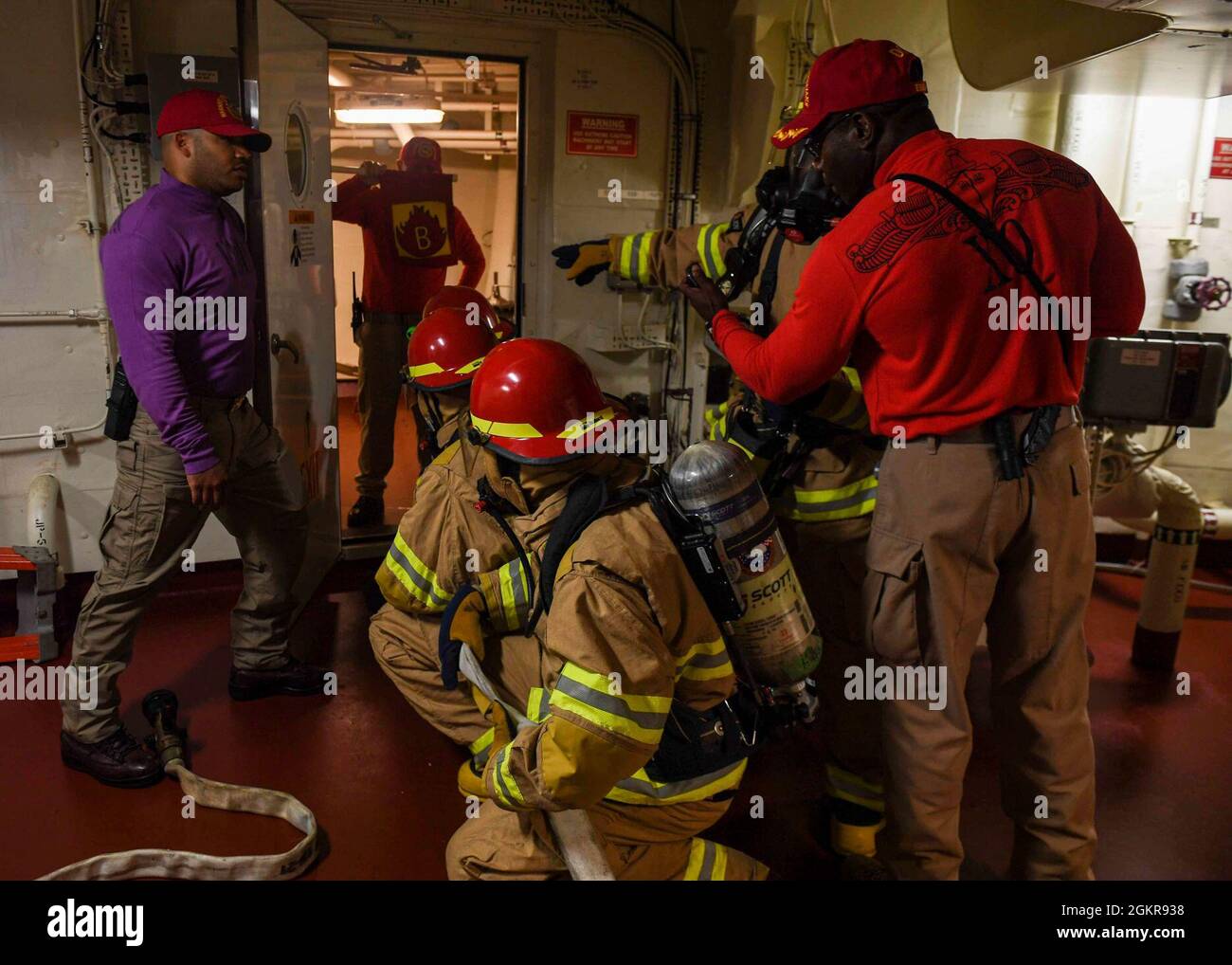 ATLANTIC OCEAN (JUNE 18, 2021) The primary hose team simulates fighting ...
