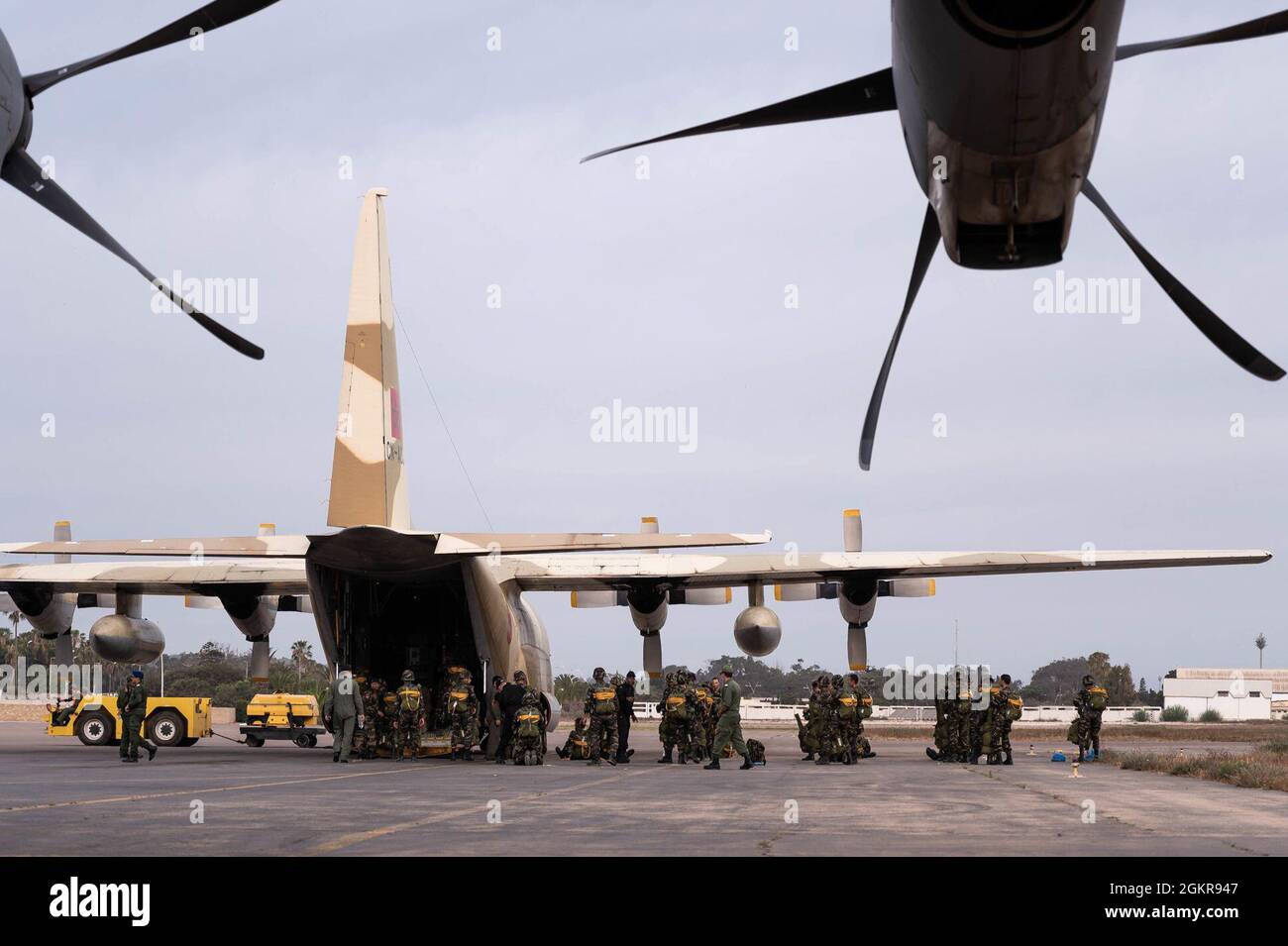 Royal Moroccan Air Force paratroopers load onto a RMAF C-130 Hercules ...