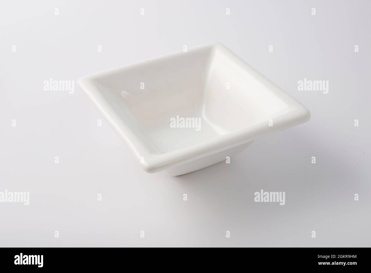 Empty square pot on white background Stock Photo - Alamy