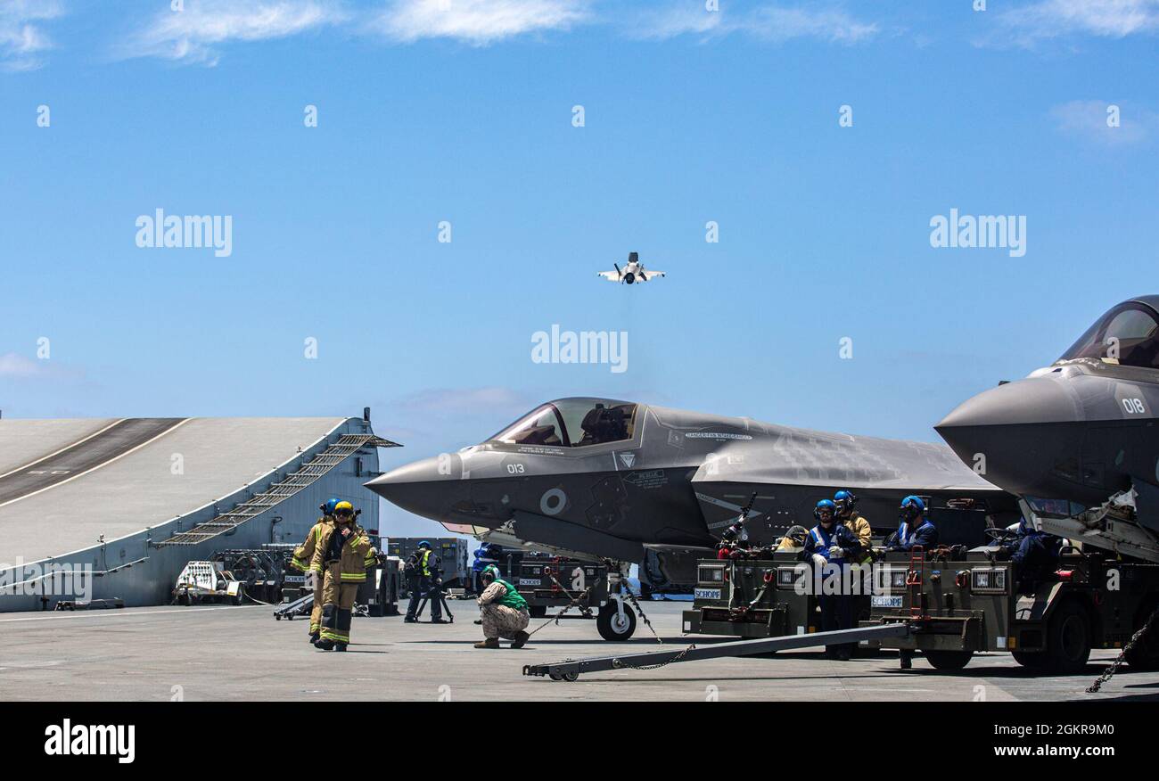 A U.S. Marine with Marine Fighter Attack Squadron (VMFA) 211, Carrier ...