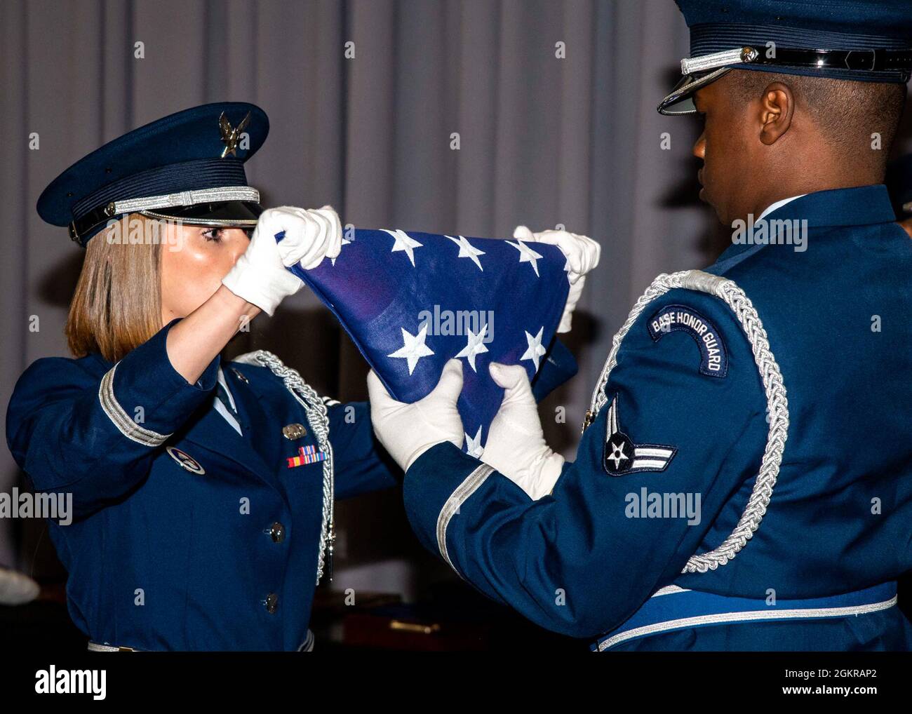 Members of the Dover Air Force Base Honor Guard fold the U.S. flag ...