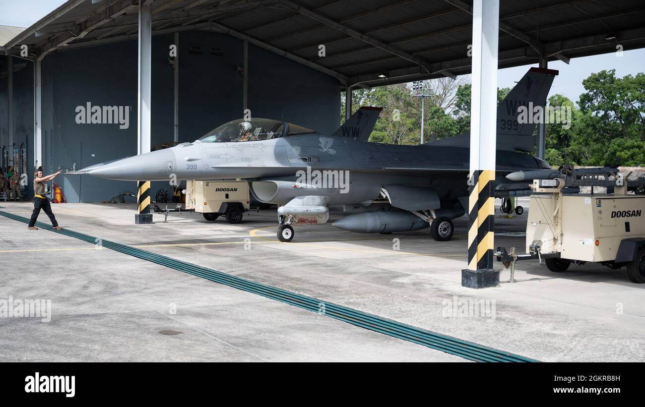 U.S. Air Force Staff Sgt. Kordell Lawrence marshals U.S. Air Force Capt ...