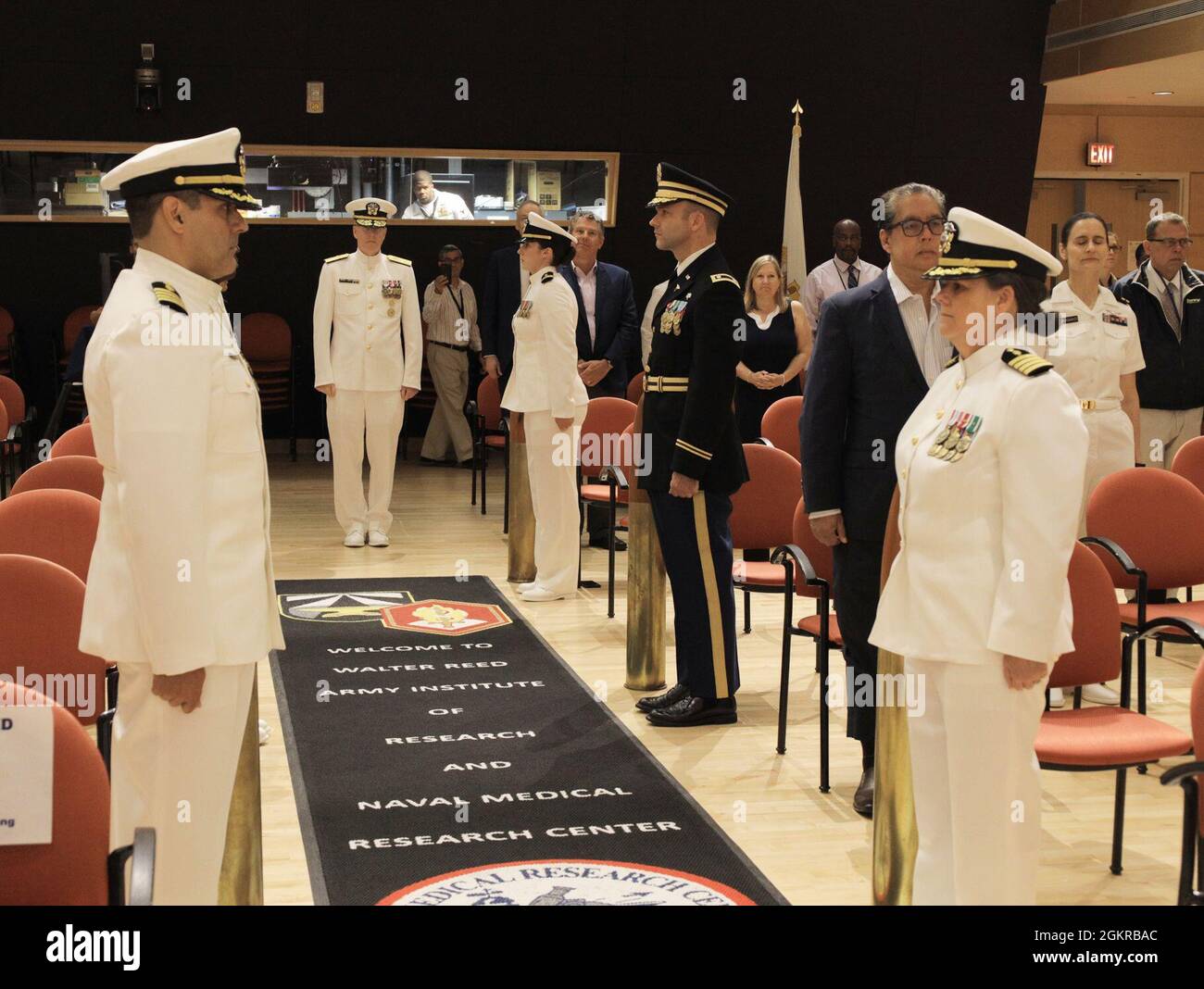 Rear Adm. Tim Weber, commander, Naval Medical Forces Pacific, prepares to pass through sideboys ...