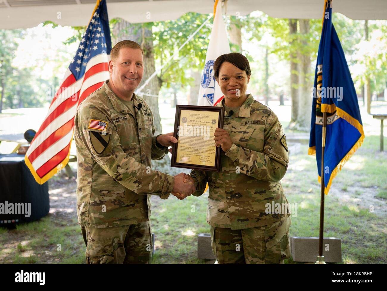Lt. Col. Melissa Johnson receives the Product Manager Soldier Maneuver ...