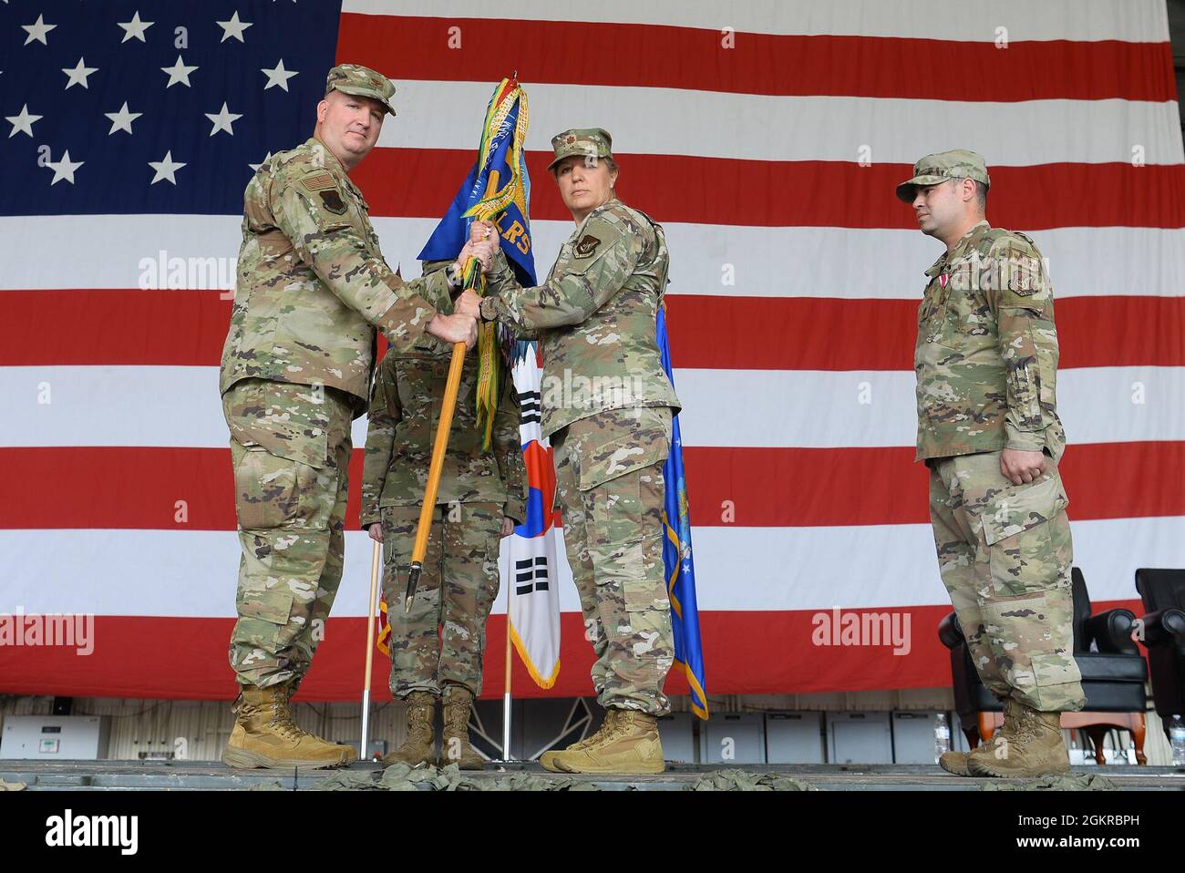 Col. Robert Bartlow, 8th Mission Support Group commander, presents the ...