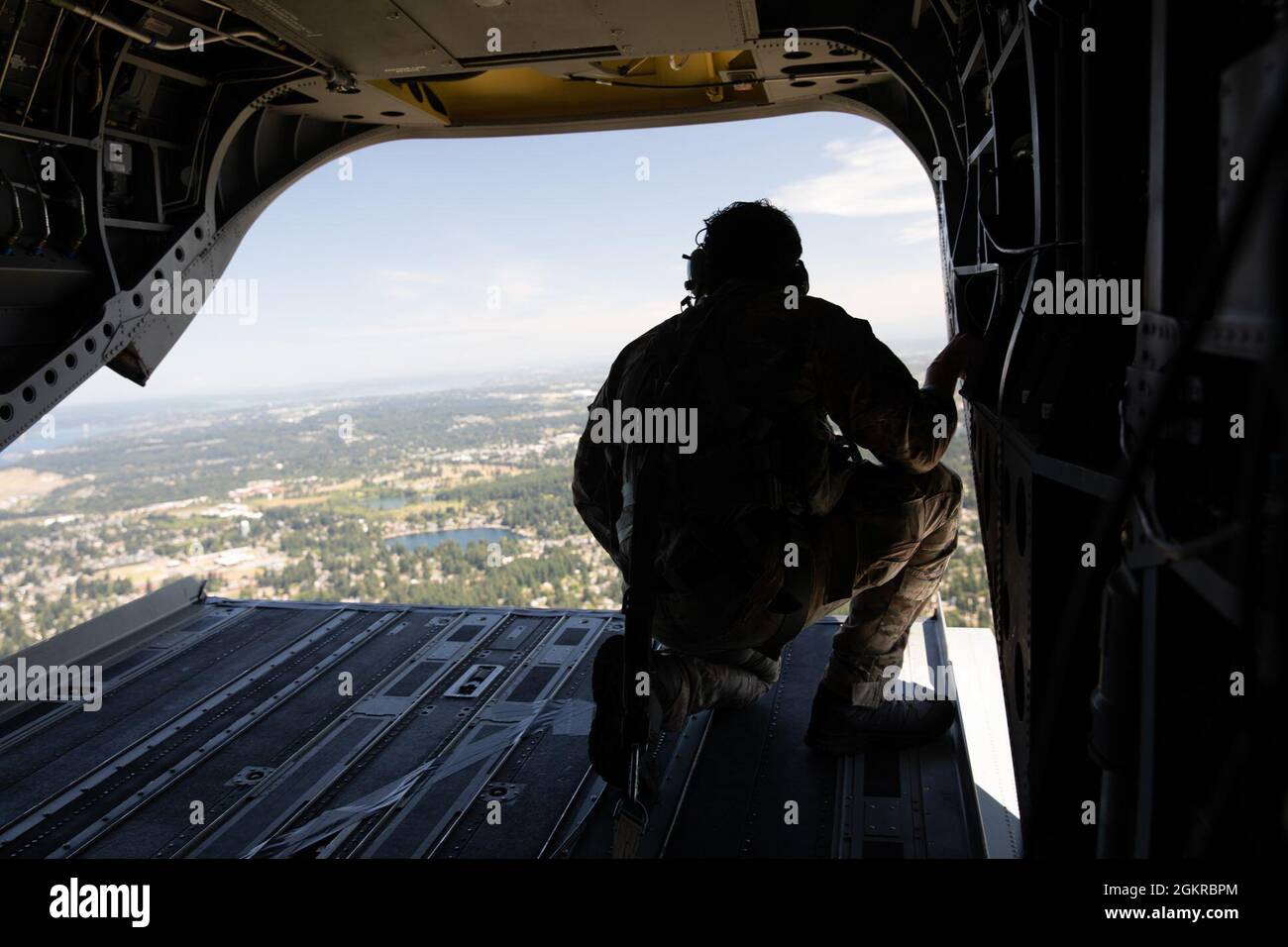 A CH-47 Chinook crewmember surveys the land outside of American Lake ...