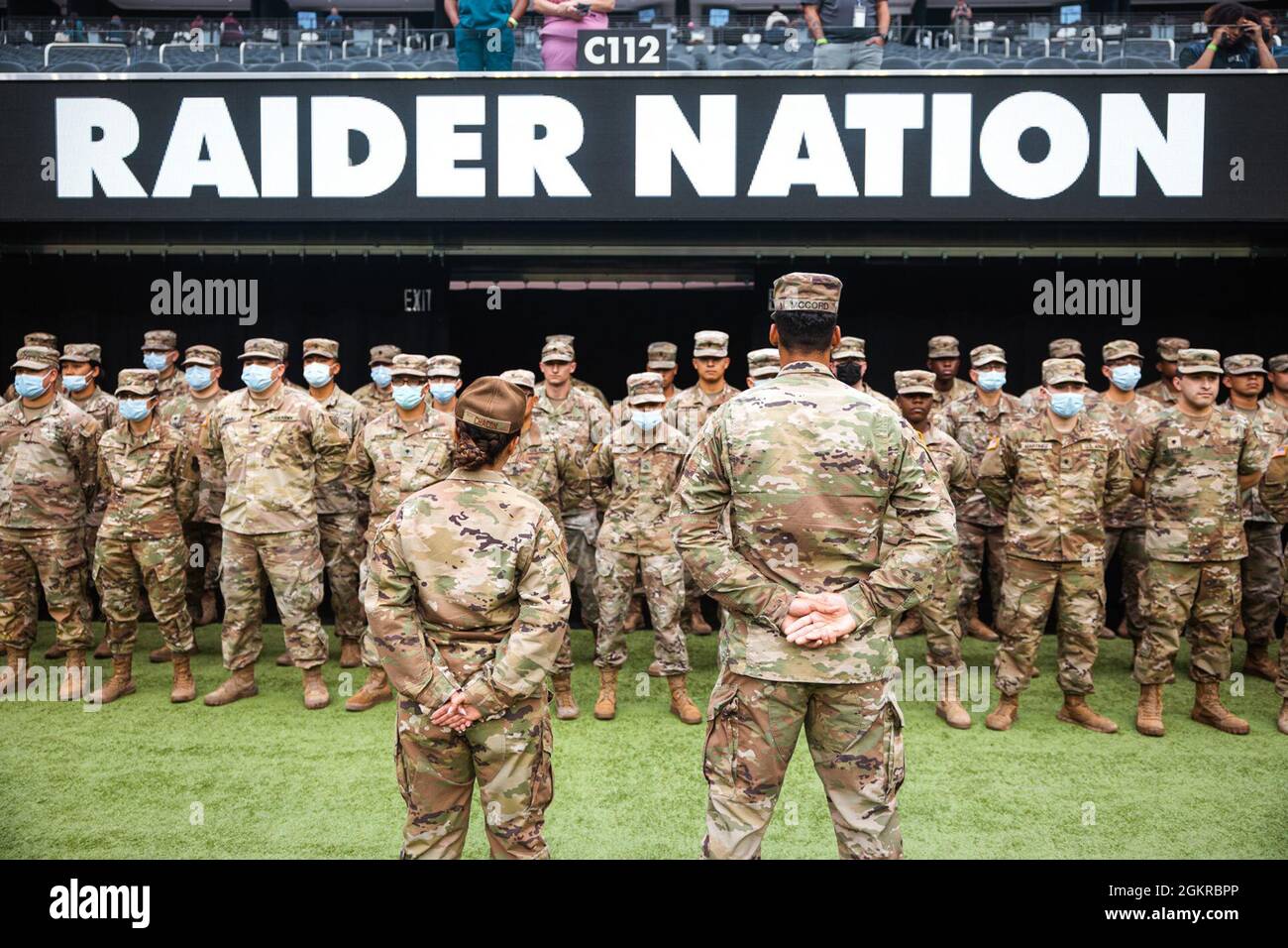 Soldiers stand at parade rest for a promotion ceremony at Allegiant ...