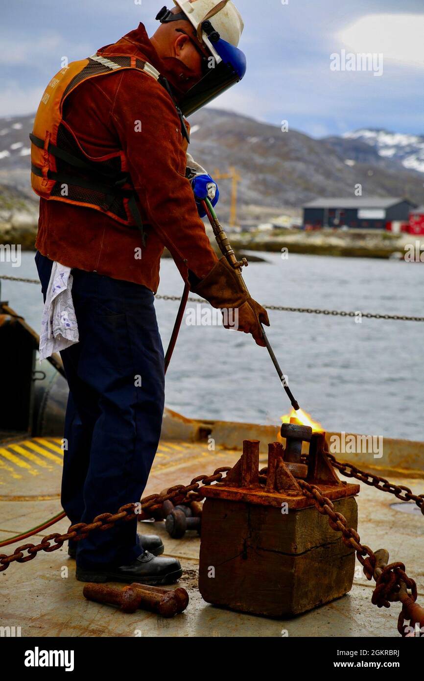 The USCGC Maple (WLB 207) crew member welds on the buoy deck in ...