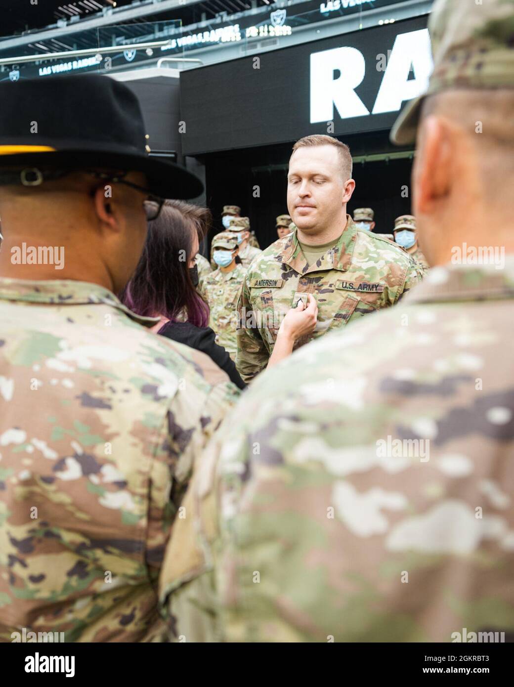 Staff Sgt. Robert Anderson’s wife, Melissa, pins rank during a ...