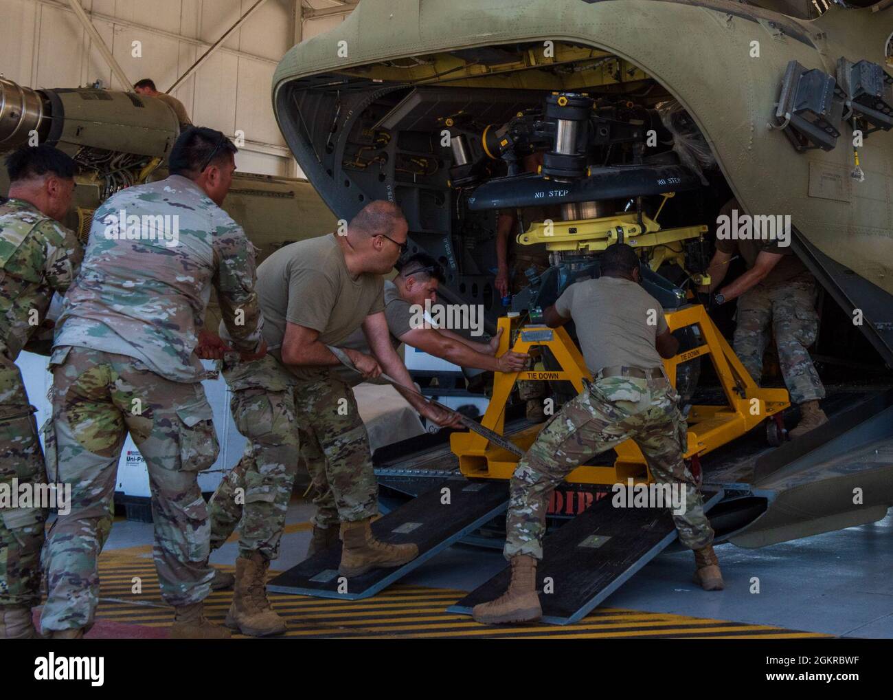 U.S. Army maintainers remove a rotor assembly stored in a CH-47 Chinook ...