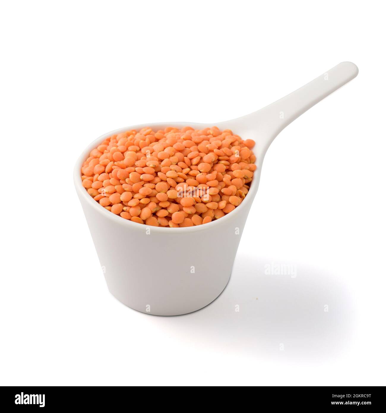 white cup full of red lentils isolated on white Stock Photo - Alamy