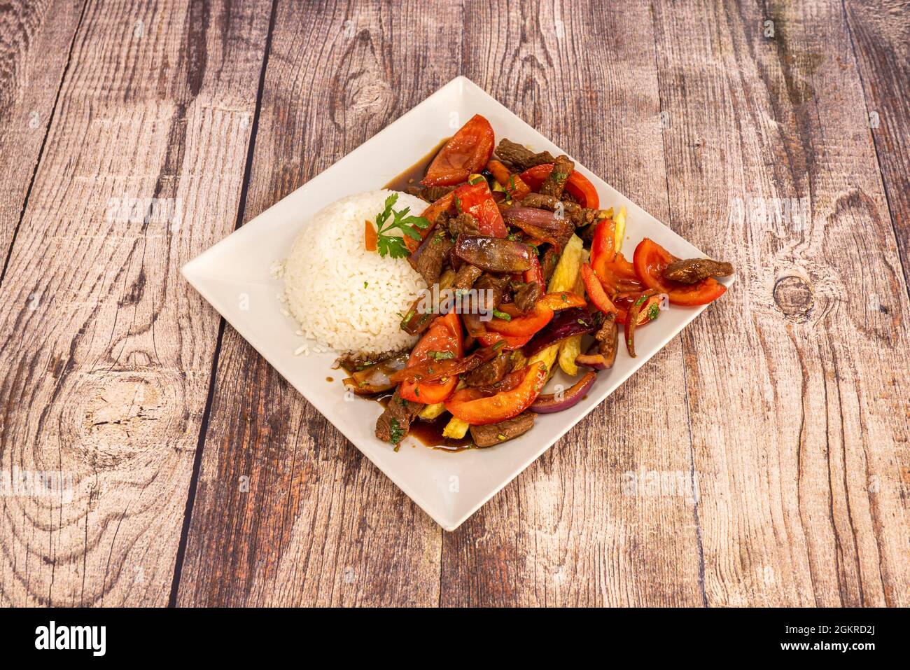 Fantastic traditional Peruvian lomo saltado recipe with portion of ...