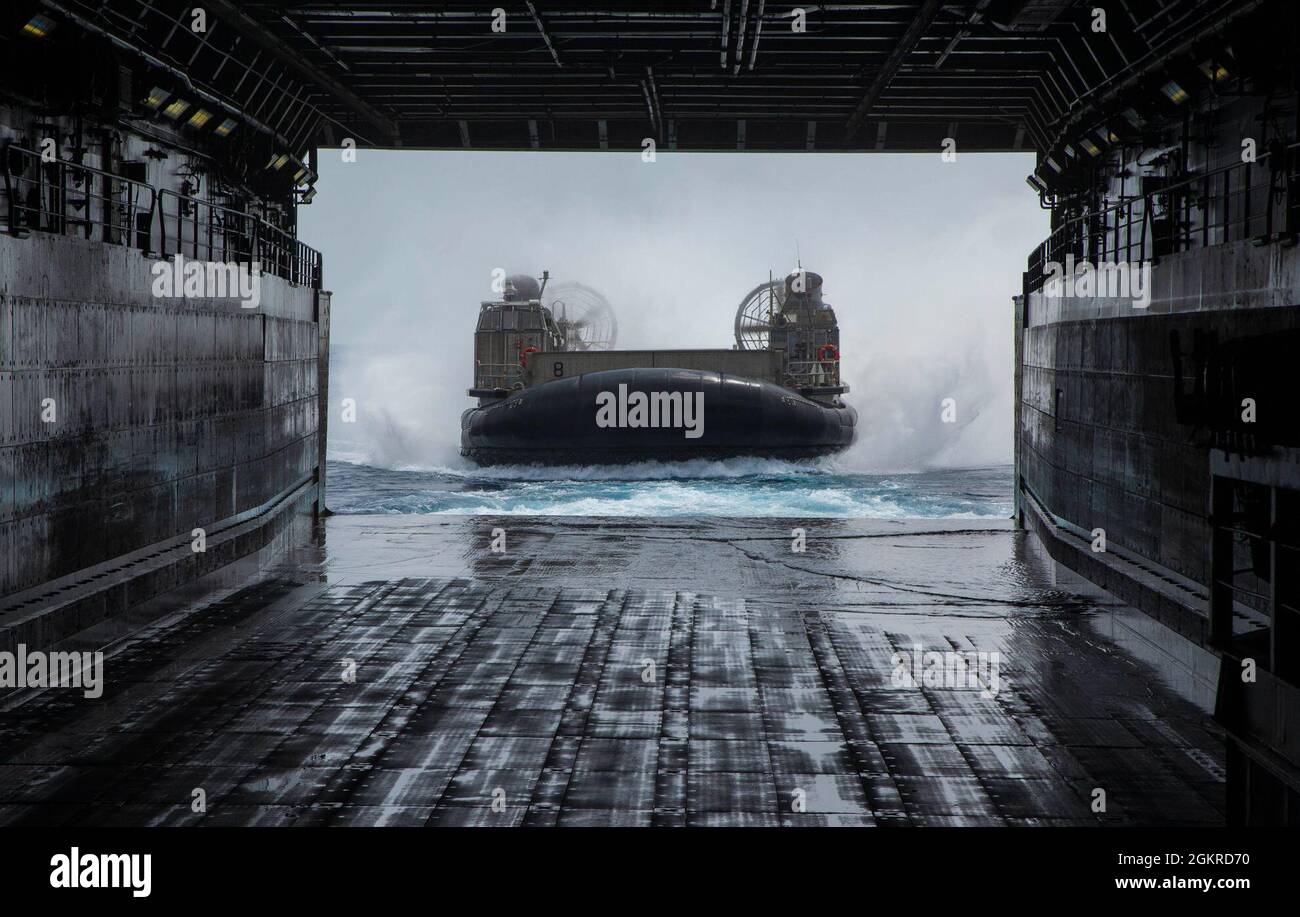 U.S. Marines and Sailors aboard the amphibious assault ship USS New ...