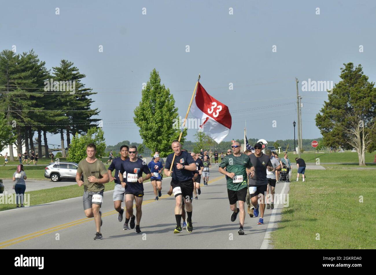Retired Army Cpl. Phil Cook shows a memorial flag to 2nd Lt. Curt ...